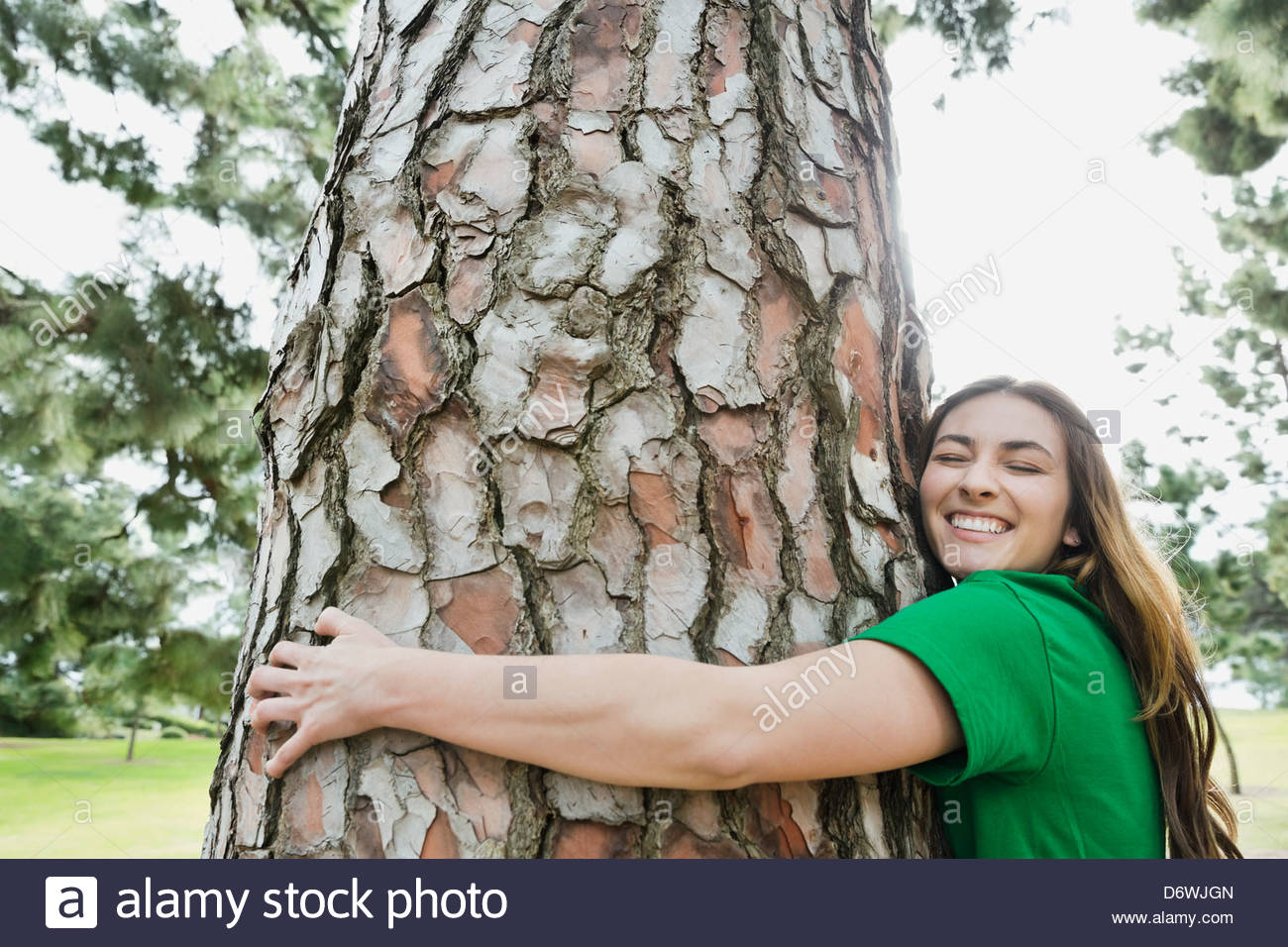 Woman with tree hi-res stock photography and images - Alamy