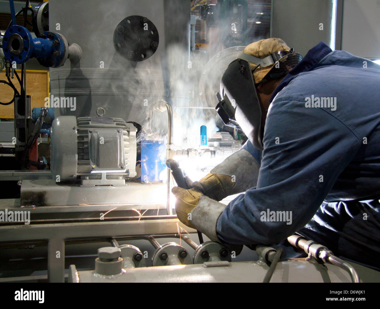 Skilled factory welder Stock Photo - Alamy