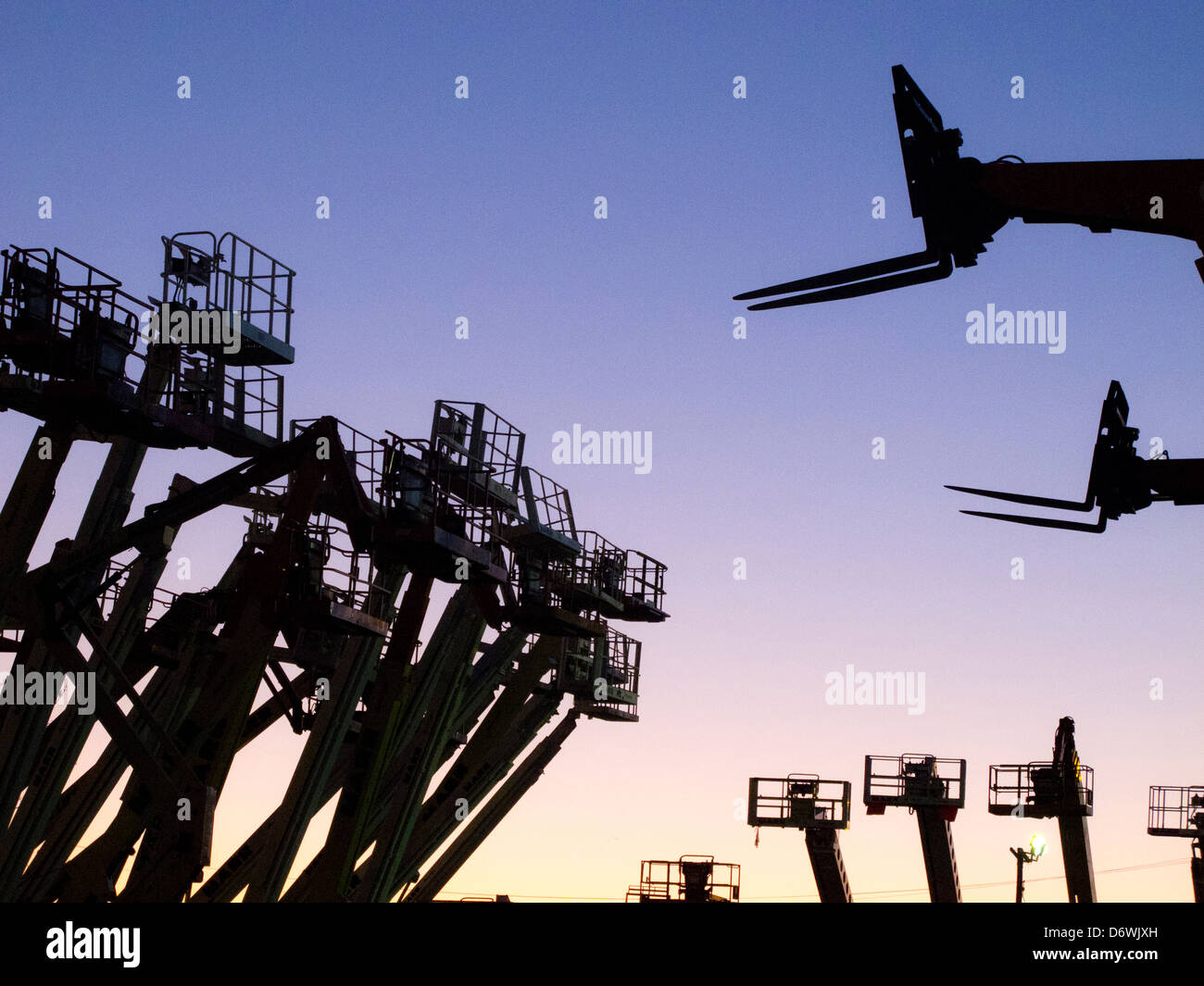 Low angle view of cherry pickers Stock Photo - Alamy