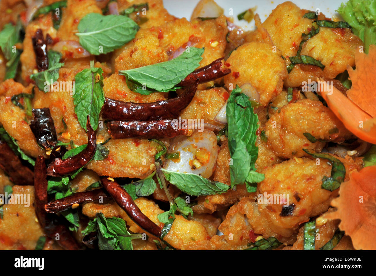 Thailand, Bangkok, Thai roasted fish with hot peppers and mint garnish ...