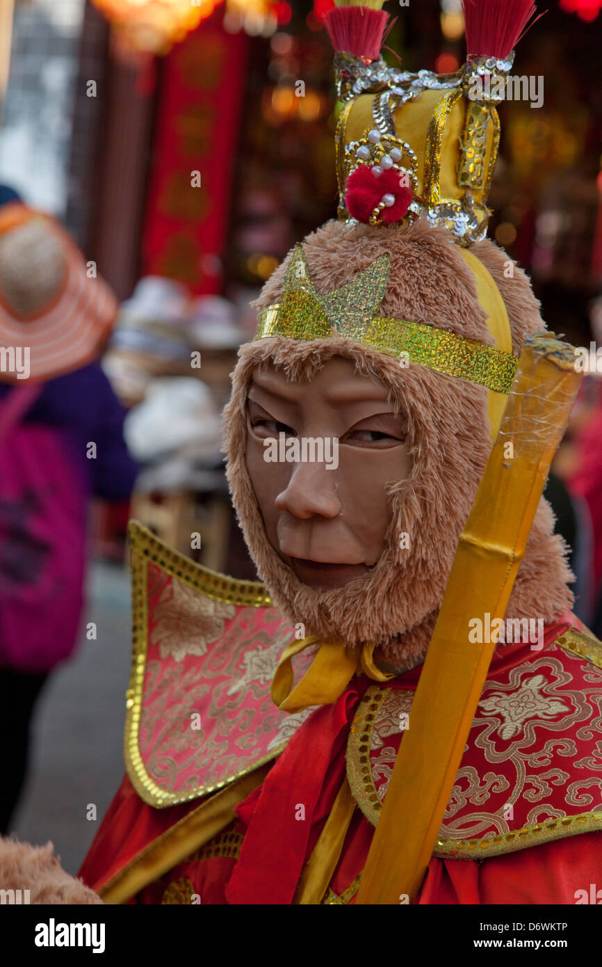 China, Man in monkey costume Stock Photo - Alamy