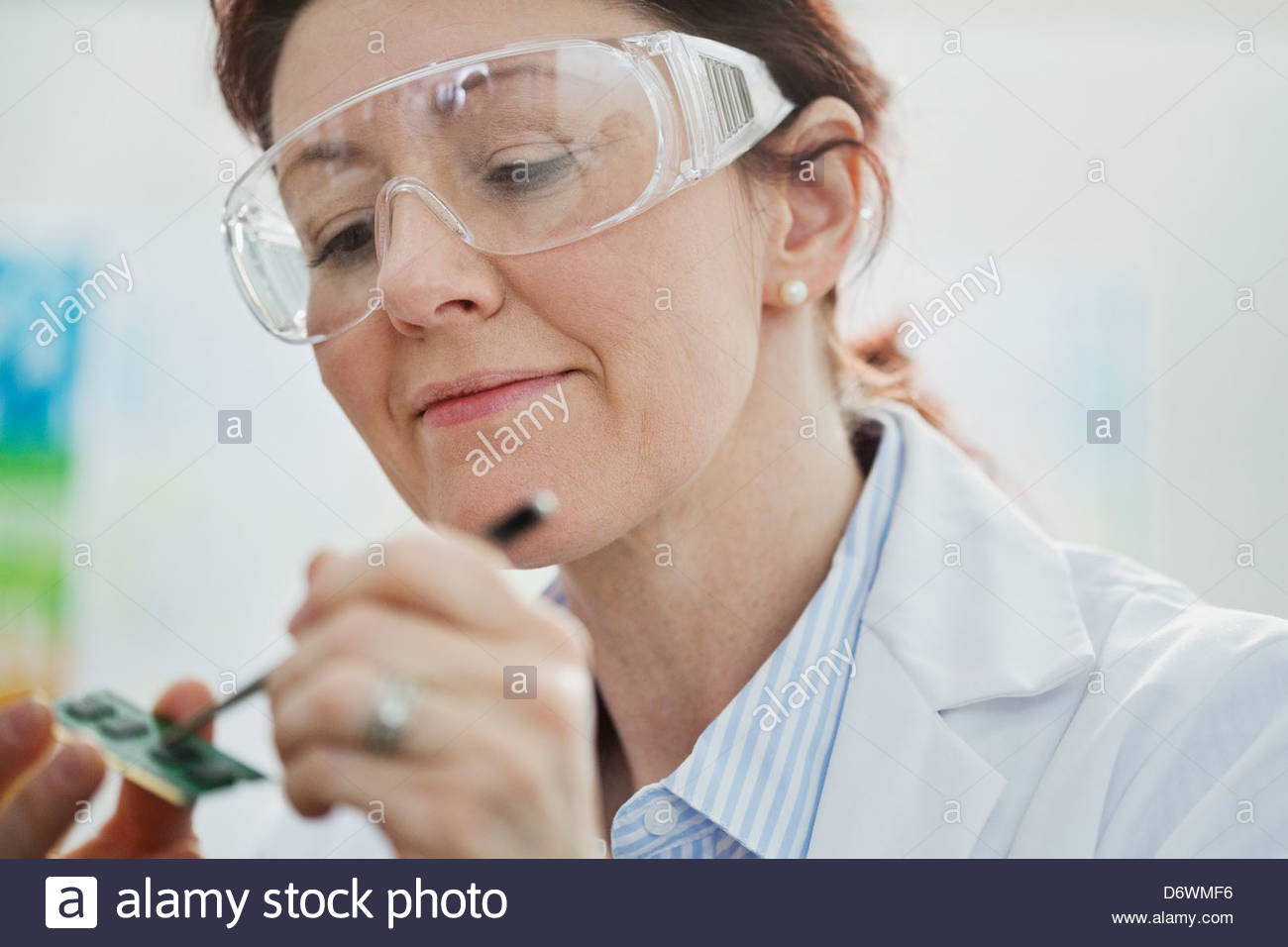 Mature female lab technician testing hi-res stock photography and ...