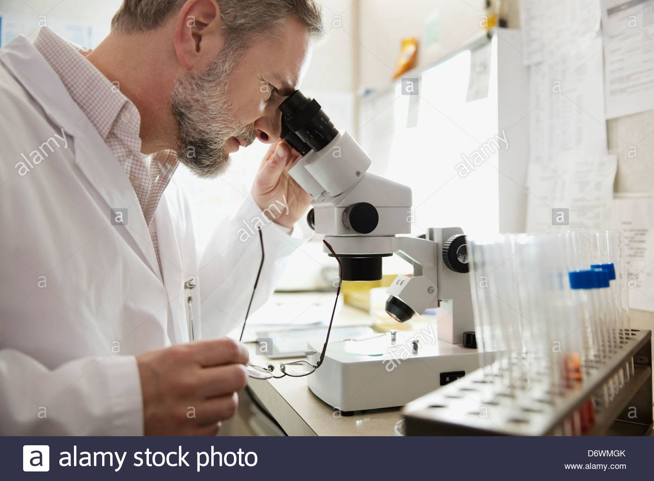 Lab worker microscope hi-res stock photography and images - Alamy