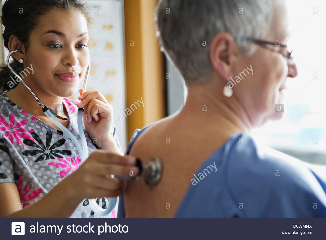 Doctor back using stethoscope hi-res stock photography and images - Alamy
