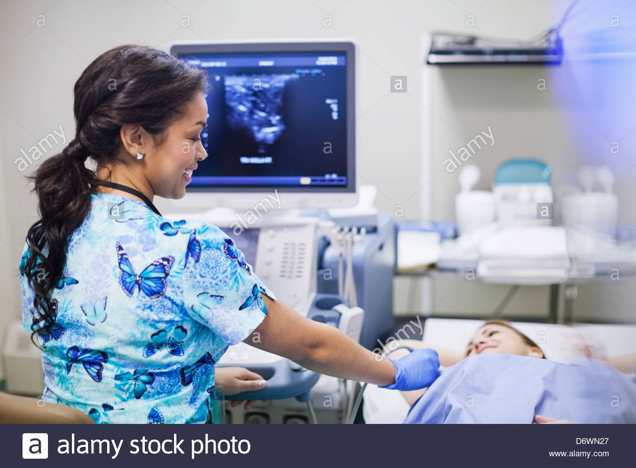 Doctor examining patient ultrasound hospital hi-res stock photography ...