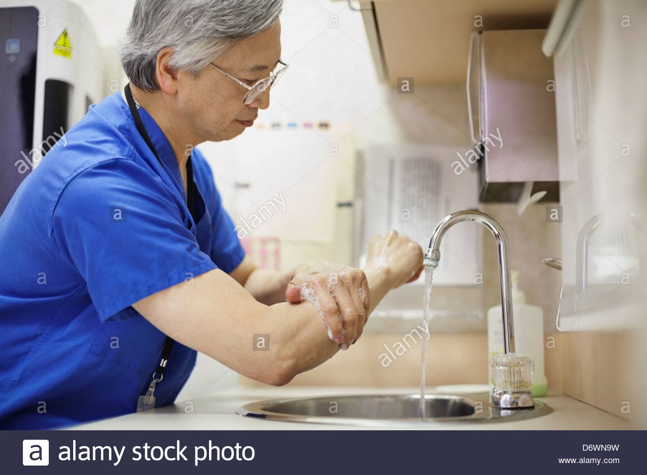 Side view male doctor washing hi-res stock photography and images - Alamy