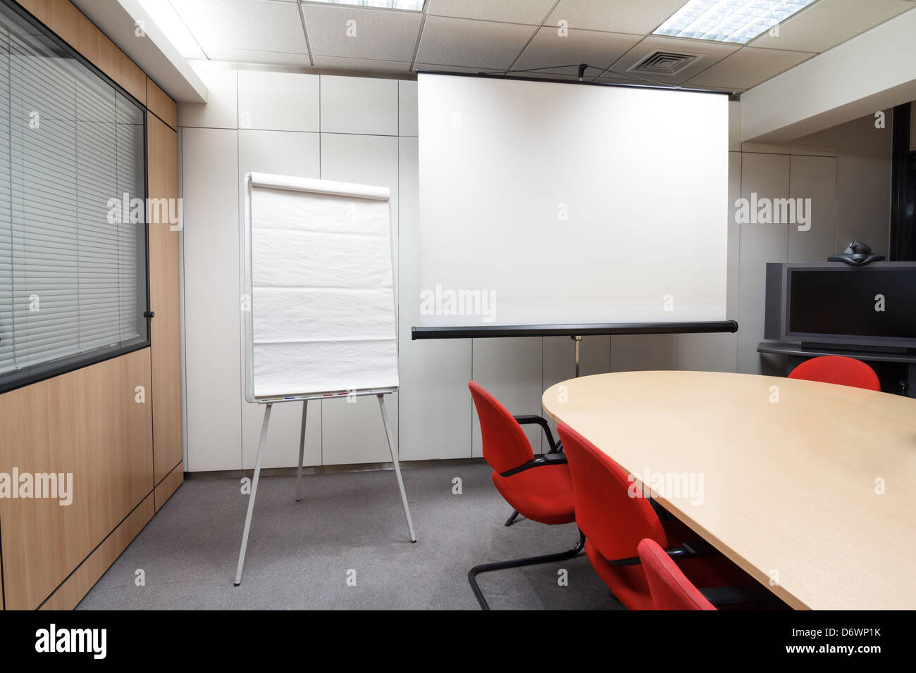 Blank projector screen and flip chart at the meeting room Stock Photo ...