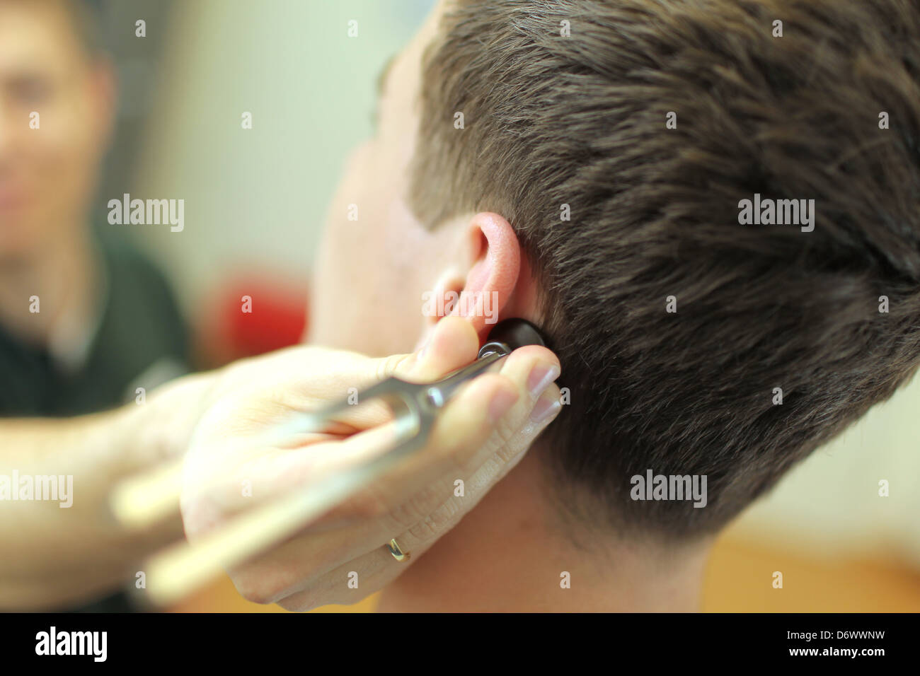 Flensburg, Germany, examination of the ear with a tuning fork Stock ...