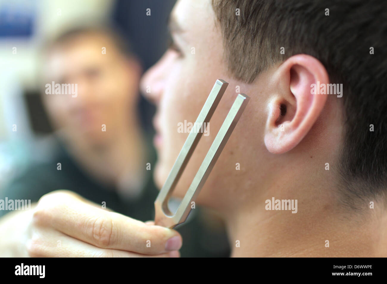 Flensburg, Germany, examination of the ear with a tuning fork Stock ...