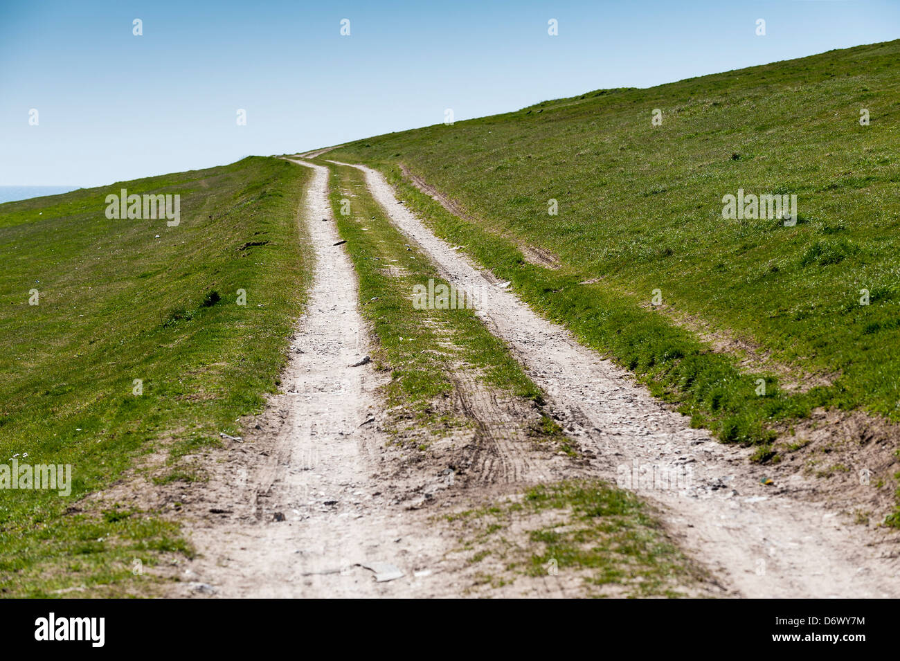 A track running across a field Stock Photo - Alamy