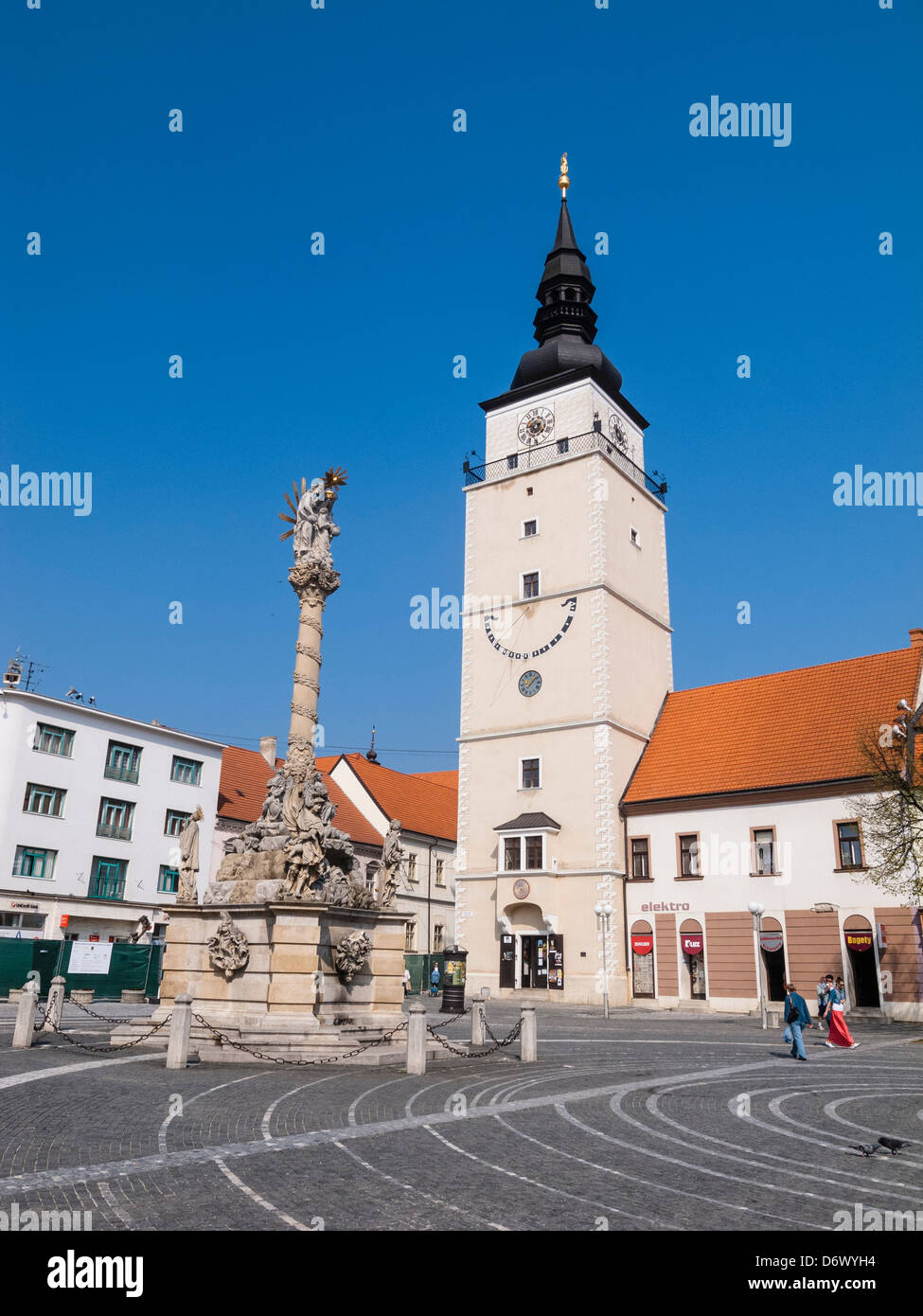 Trnava, Trojicne namestie. City tower and sculpture of Tree Saint Stock ...