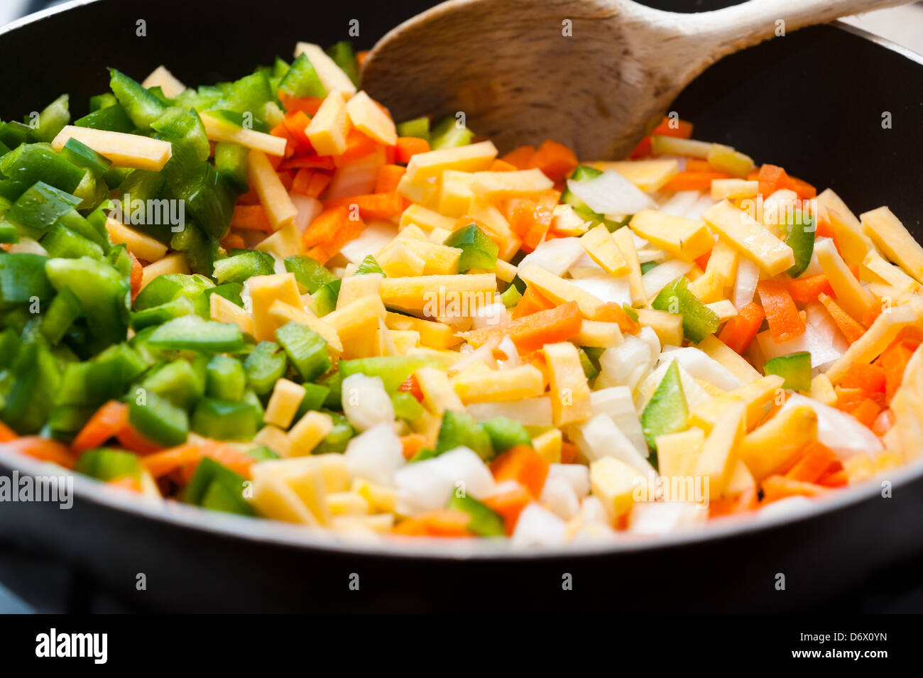 Vegetables cooking in a frying pan Stock Photo - Alamy