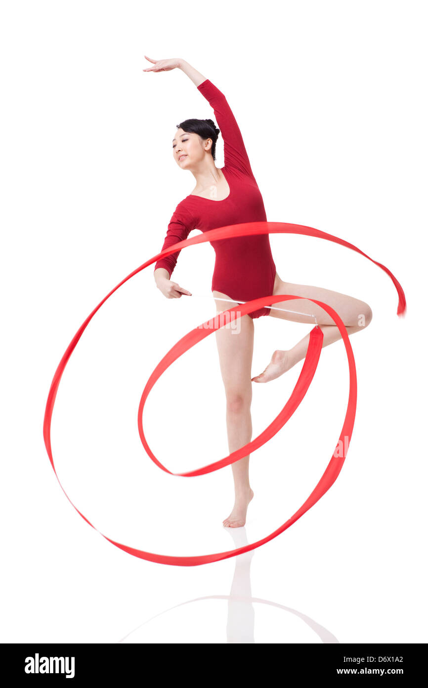 Female gymnast performing rhythmic gymnastics with ribbon Stock Photo ...