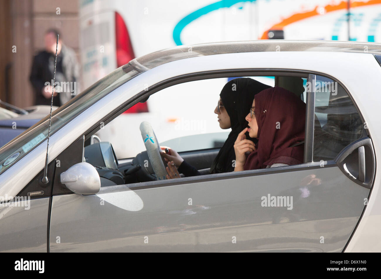 Two muslim women driving smart car hajibs Stock Photo - Alamy