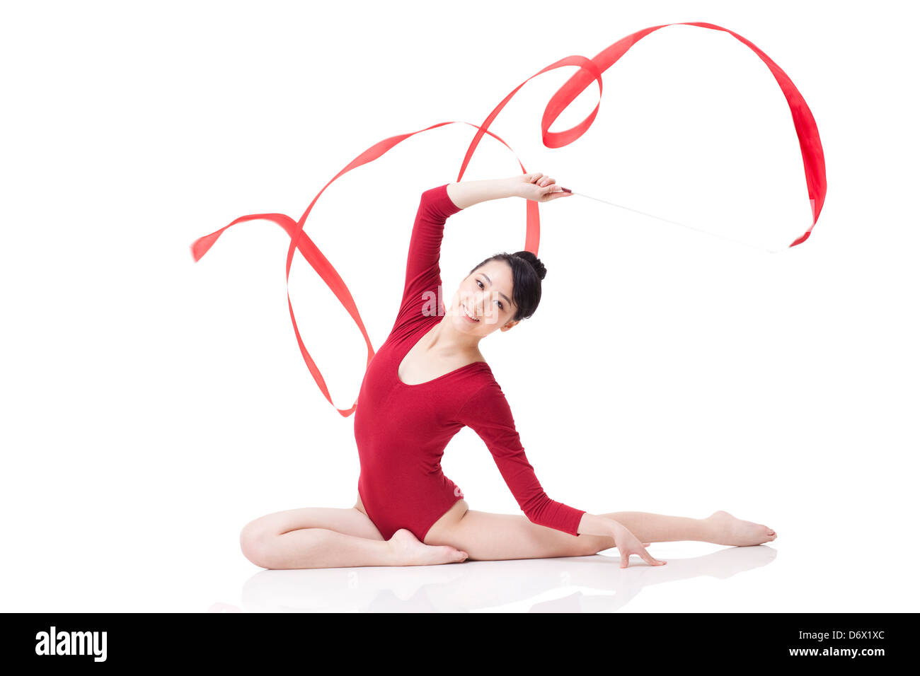 Female gymnast performing rhythmic gymnastics with ribbon Stock Photo ...