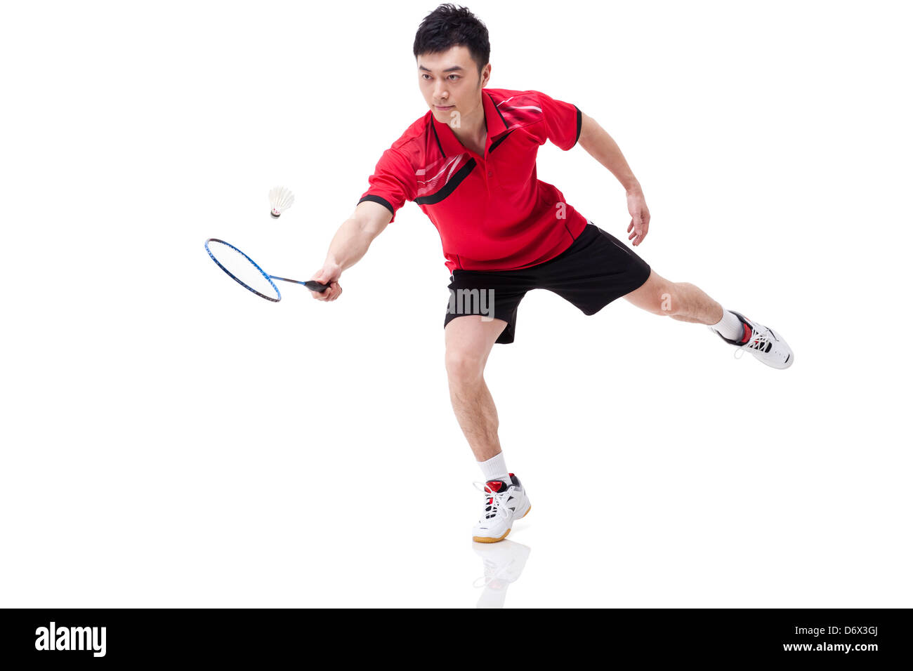 Male athlete playing badminton Stock Photo - Alamy