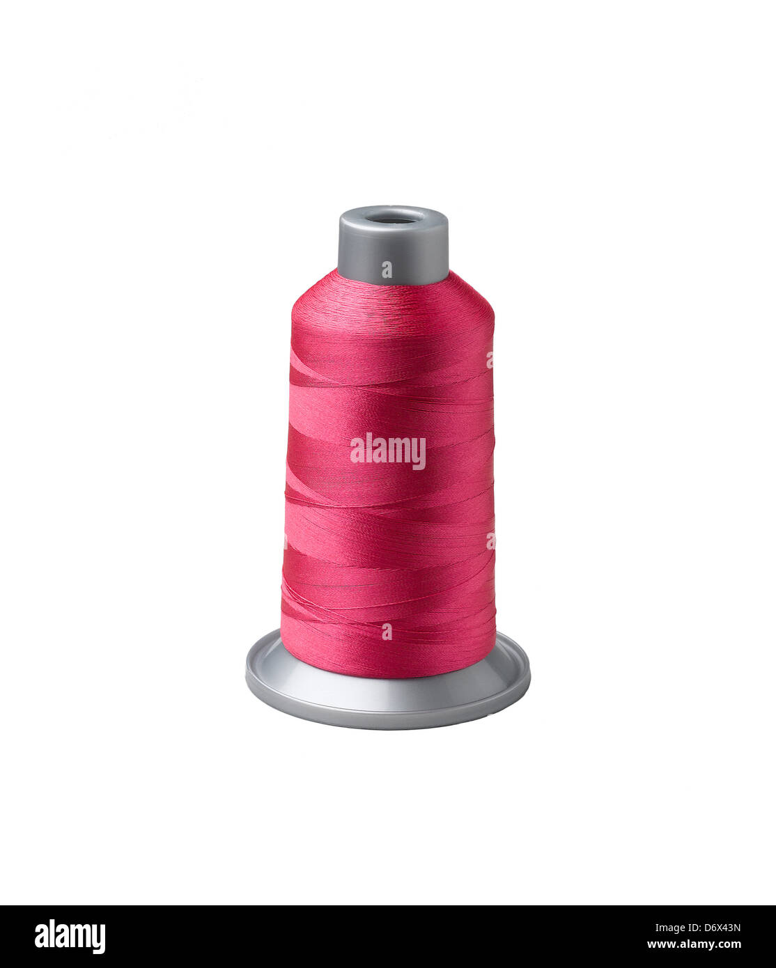 Bobbin of red thread Stock Photo - Alamy