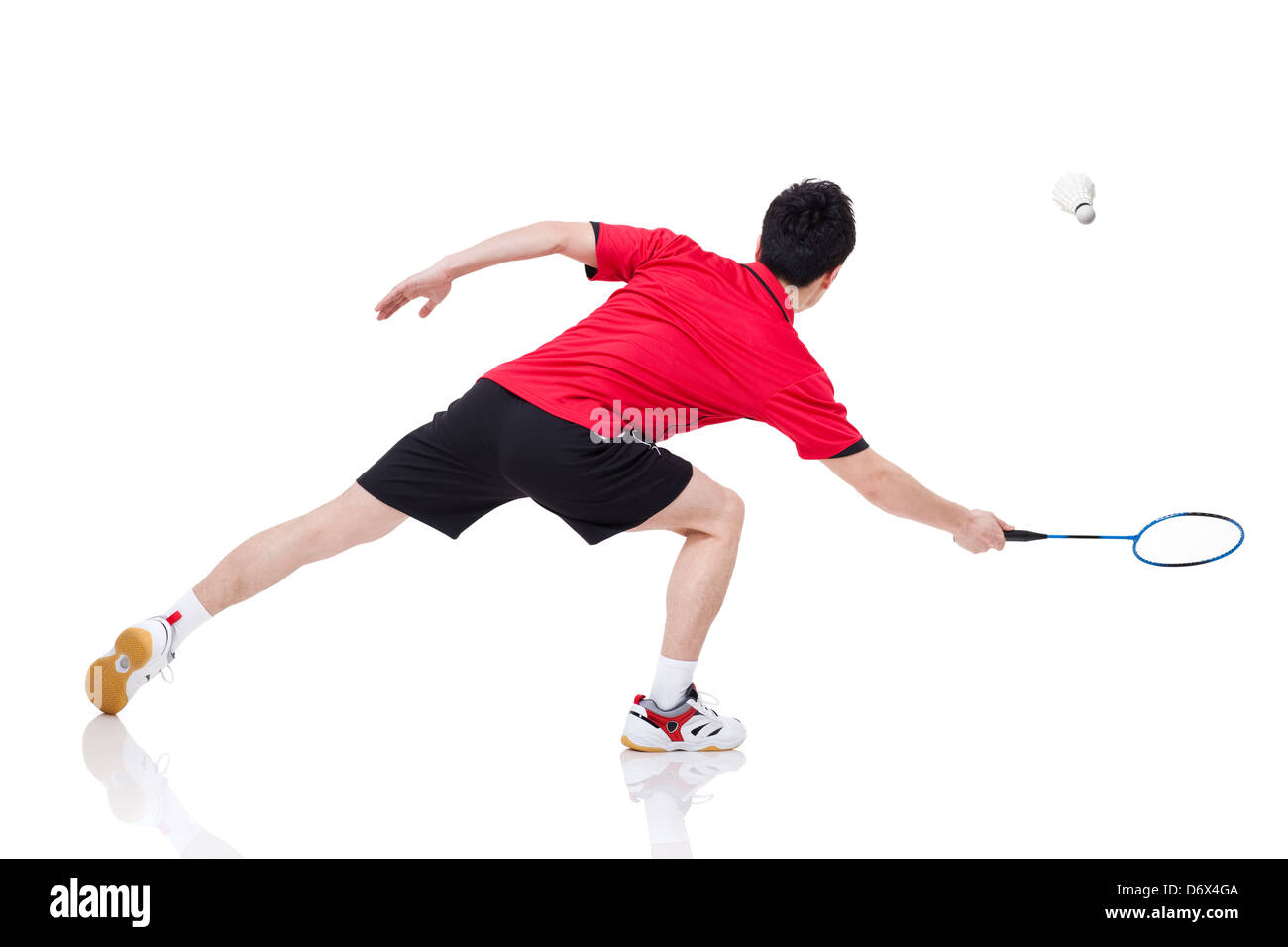 Male athlete playing badminton Stock Photo - Alamy