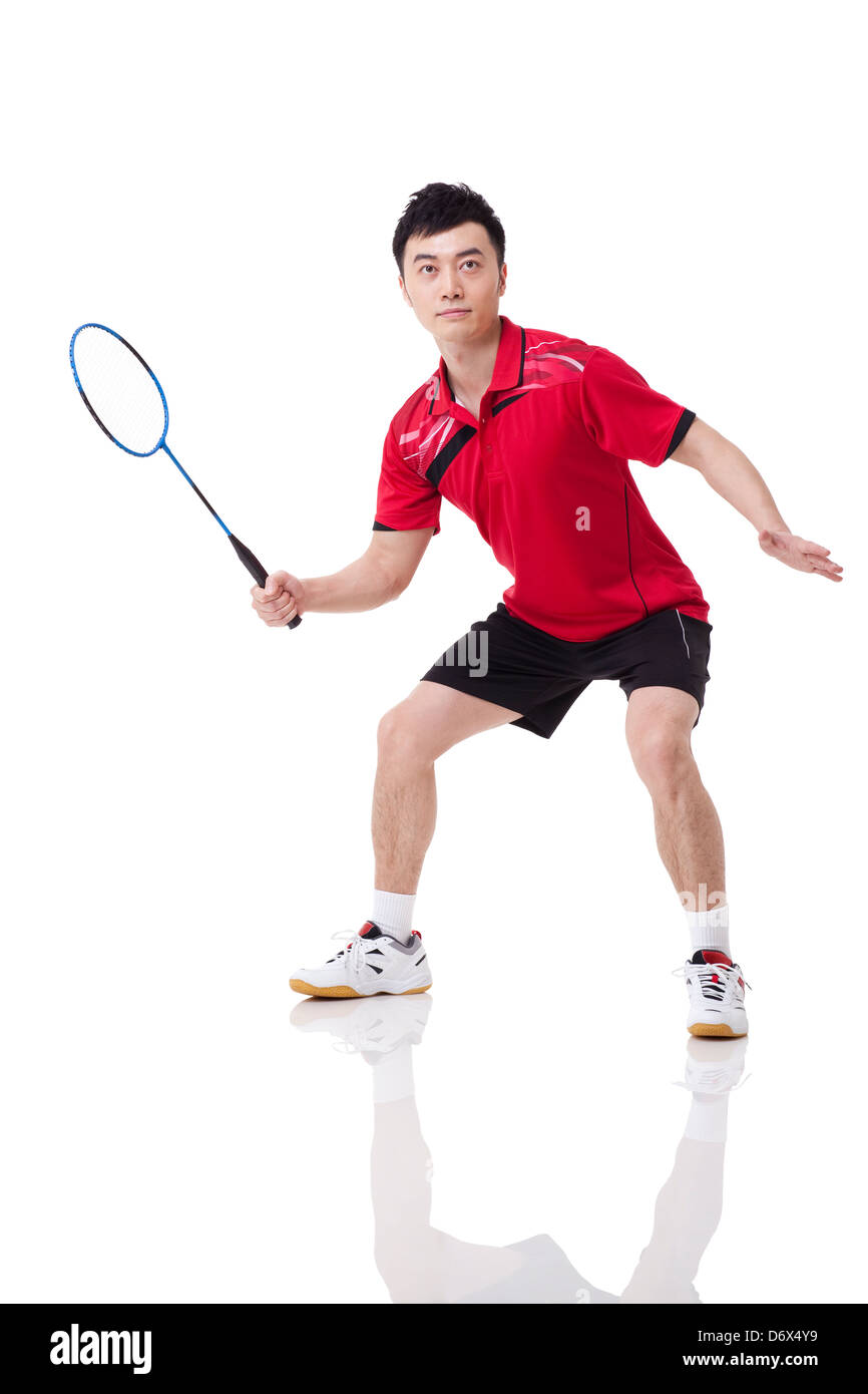 Male athlete playing badminton Stock Photo - Alamy