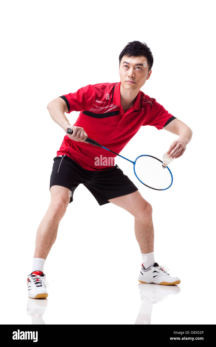 Male athlete playing badminton Stock Photo - Alamy