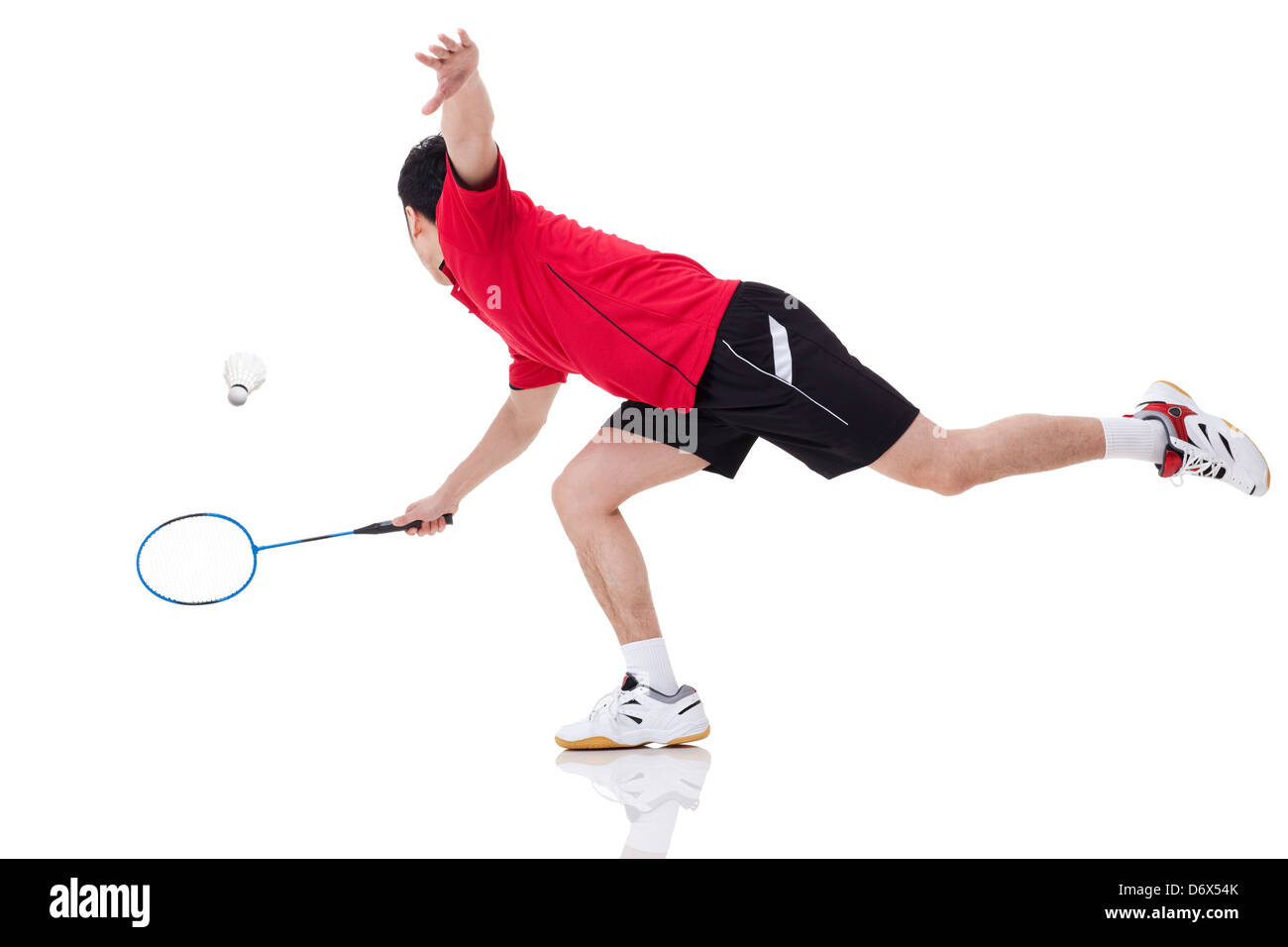 Male athlete playing badminton Stock Photo - Alamy