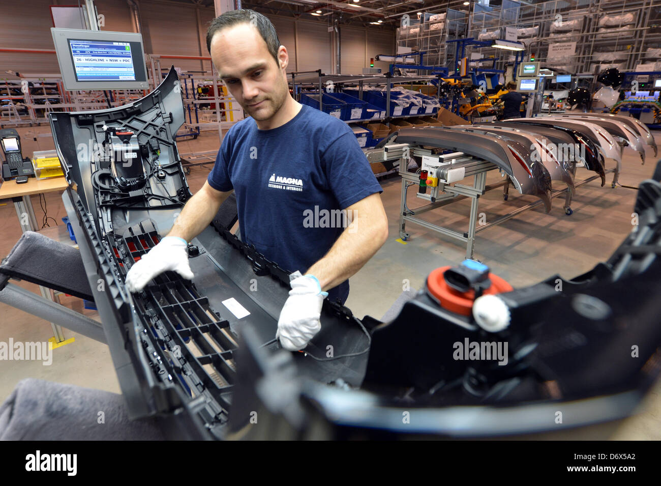 Assembler Christian Baumann checks a pumper for the VW Golf in the ...