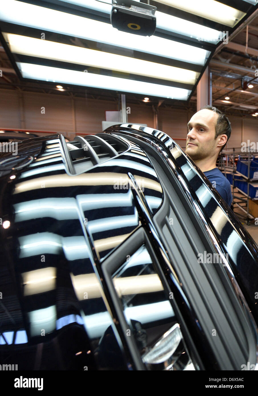 Assembler Christian Baumann checks a pumper for the VW Golf in the ...