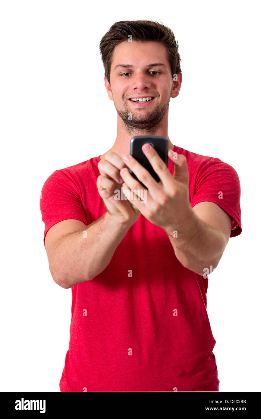 Young White Man In Red T-Shirt Working On His Smartphone Stock Photo ...