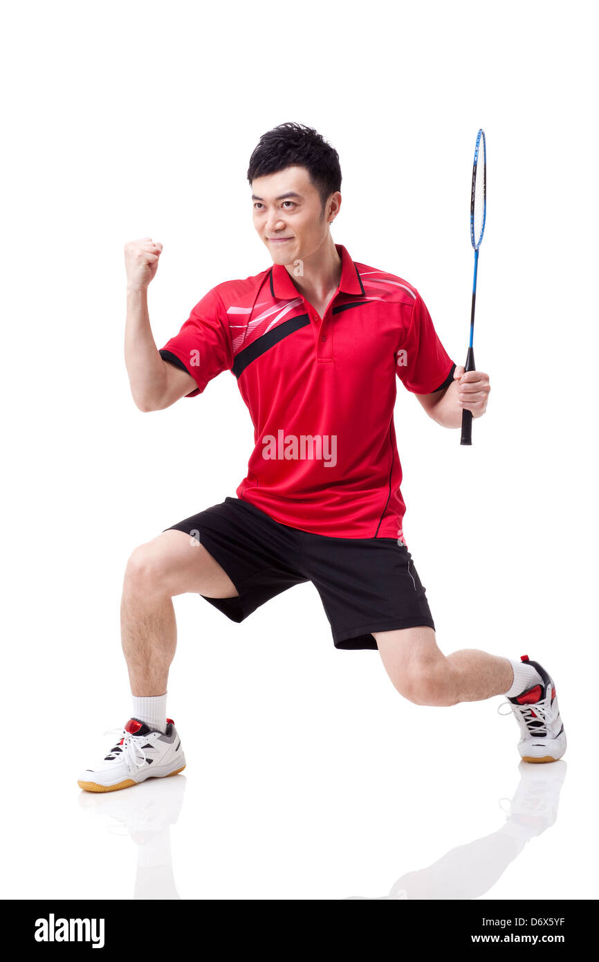 Male badminton player celebrating with excitement Stock Photo - Alamy