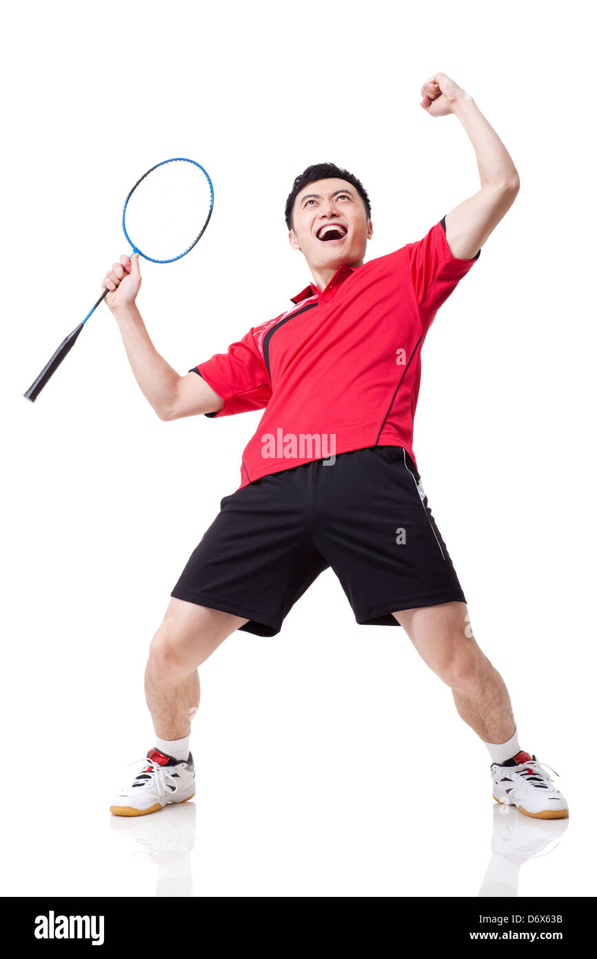 Male badminton player celebrating with excitement Stock Photo - Alamy
