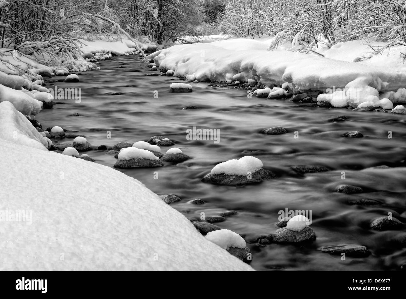 A snowy riverside scene in Switzerland Stock Photo - Alamy
