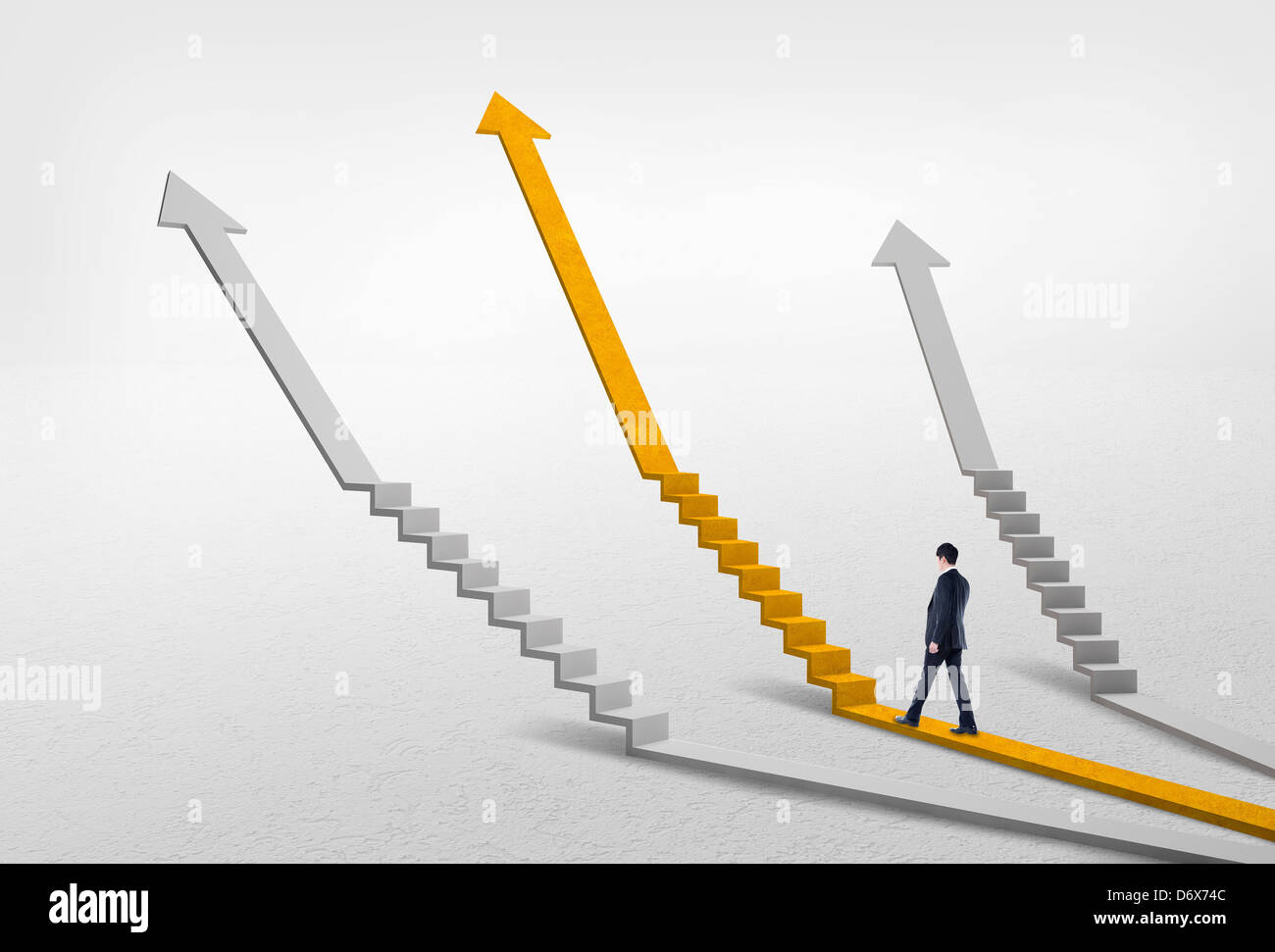 businessman climbing arrow shaped stairs Stock Photo - Alamy
