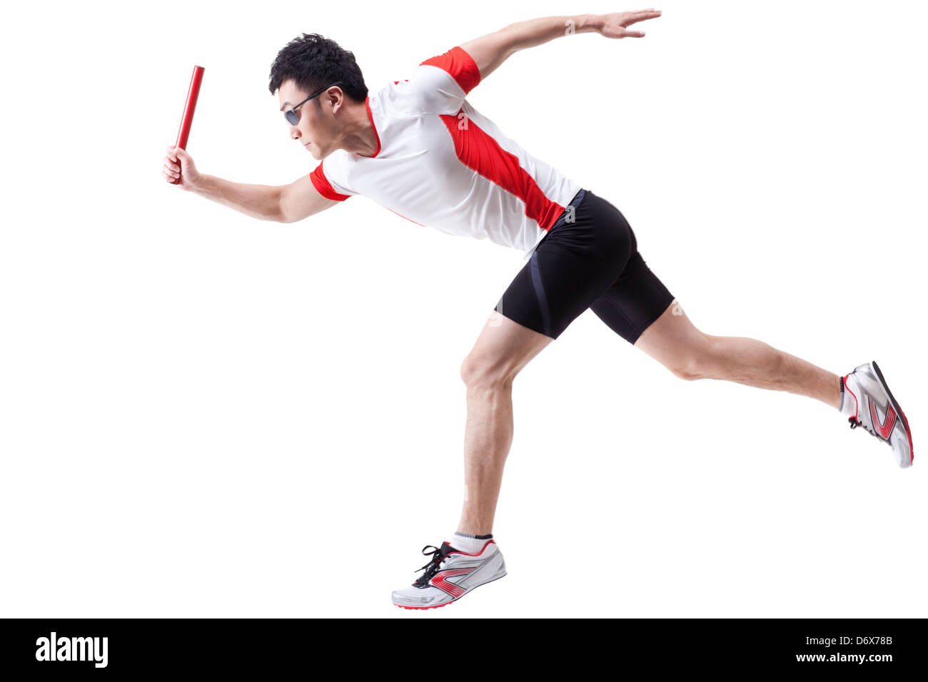 Male athlete running with relay baton Stock Photo - Alamy