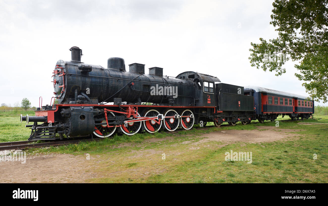 Original passengers steam-power train from the Orient Express era at the old railway station in ...