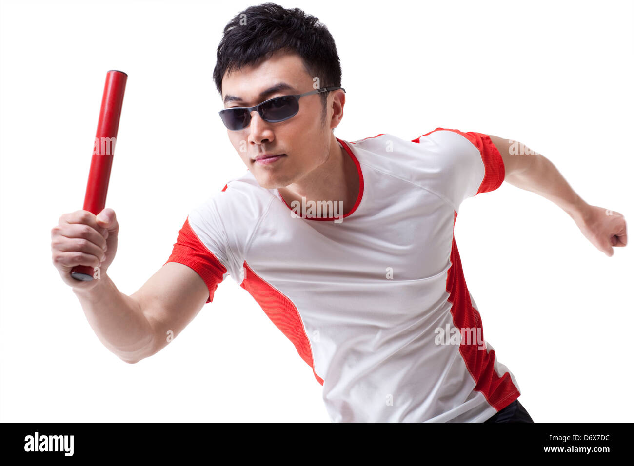 Male athlete running with relay baton Stock Photo - Alamy