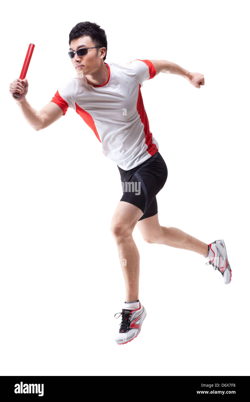 Male athlete running with relay baton Stock Photo - Alamy