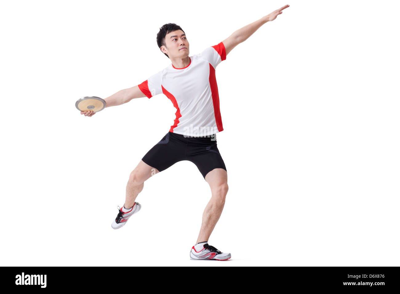 Male athlete throwing discus Stock Photo - Alamy