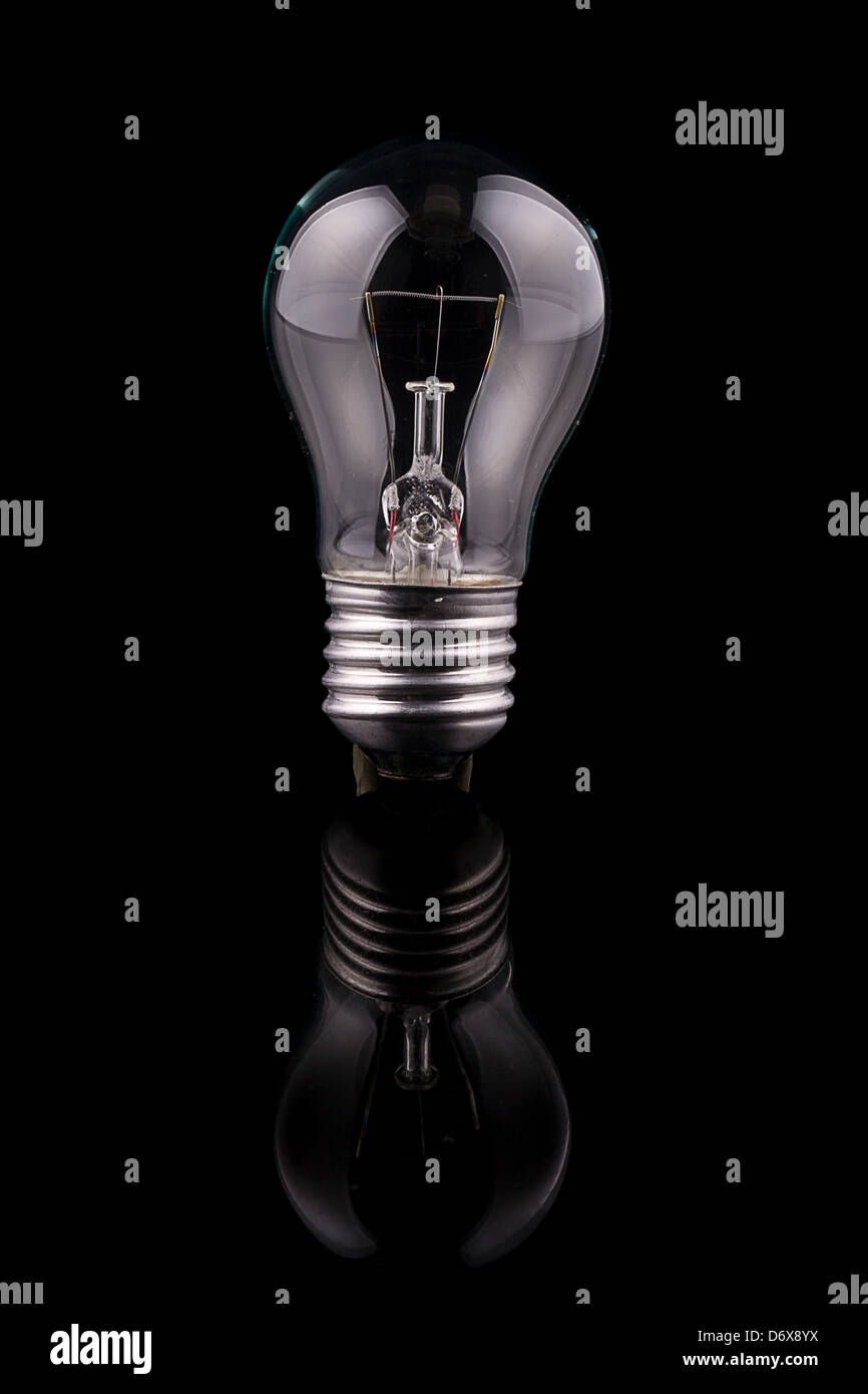 Light bulb on black background, reflection Stock Photo - Alamy