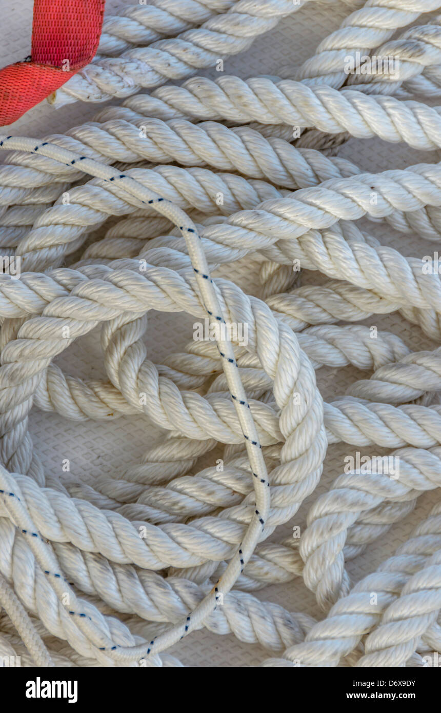 Sailing Ropes with Dash of Red Stock Photo - Alamy