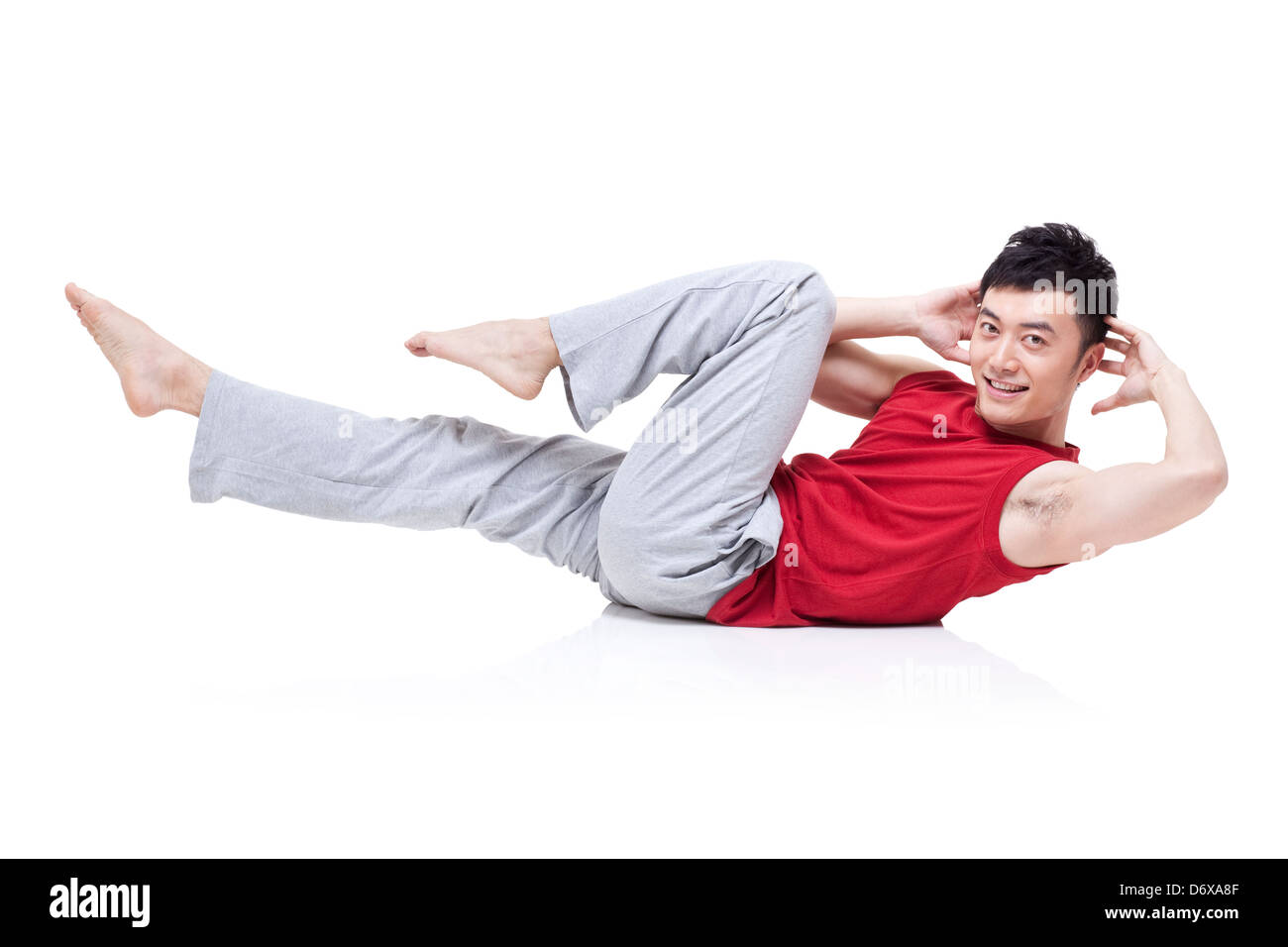 Young man doing yoga Stock Photo - Alamy