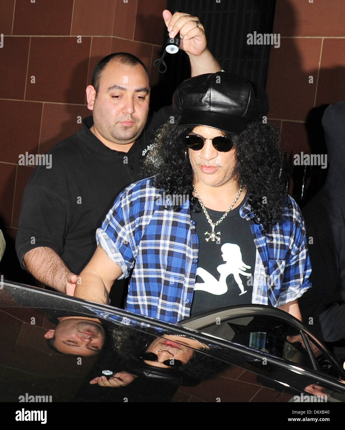 Slash (real name Saul Hudson) gets into a car outside C London Stock ...