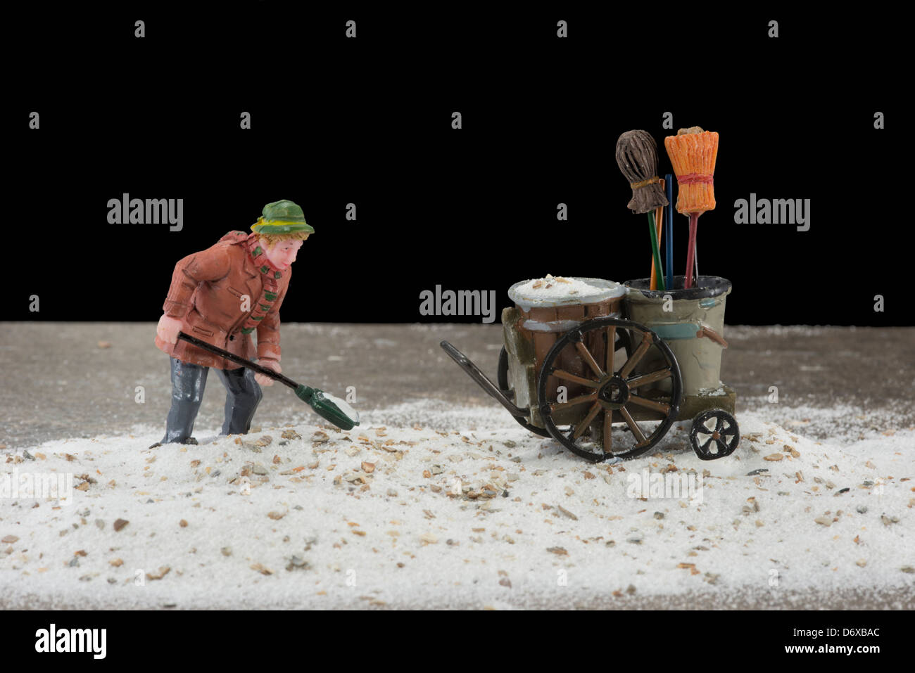 man cleaning the street from sand in the dark Stock Photo - Alamy