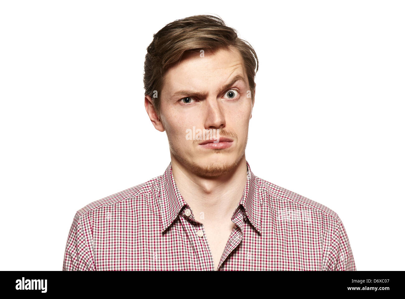 Handsome young man isolated over white. Funny face Stock Photo - Alamy