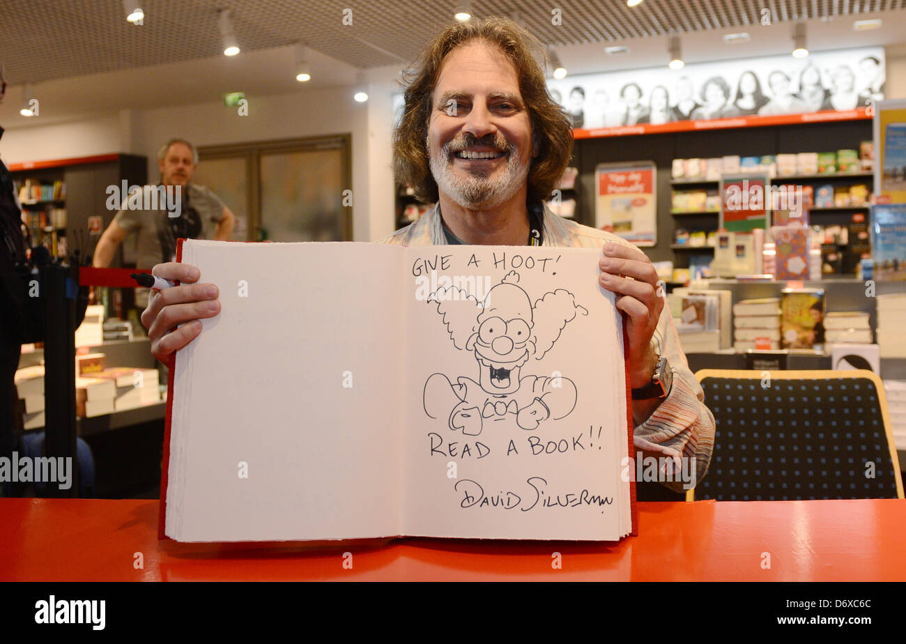 Director David Silverman presents a Simpson figure he drew on the ...