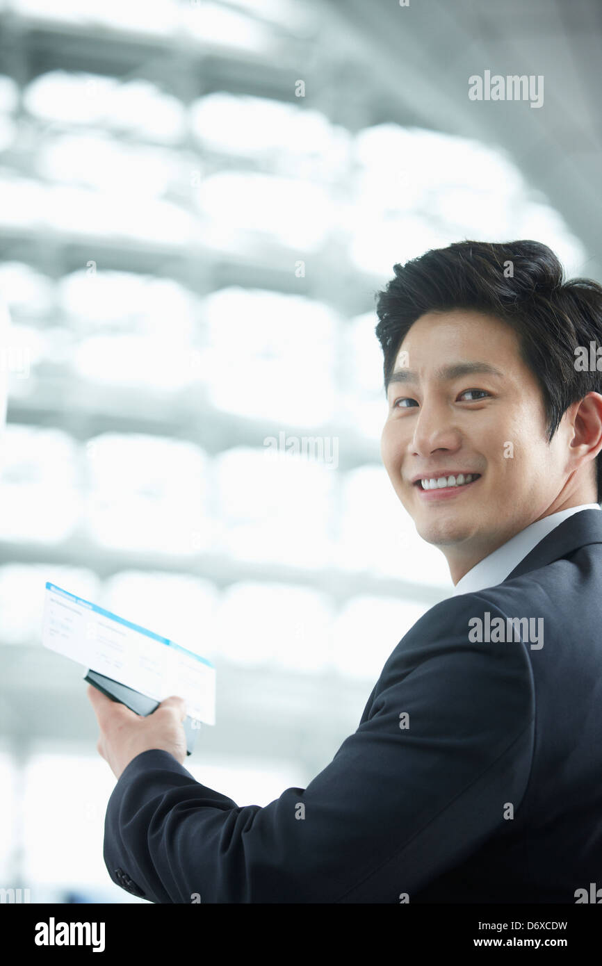 back shot of a businessman holding a boarding pass and passport Stock ...