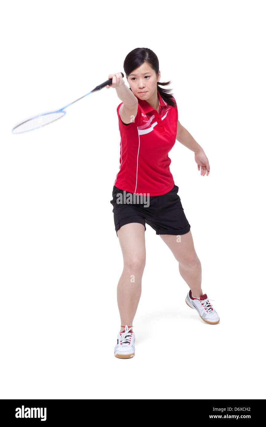 Female athlete playing badminton Stock Photo - Alamy