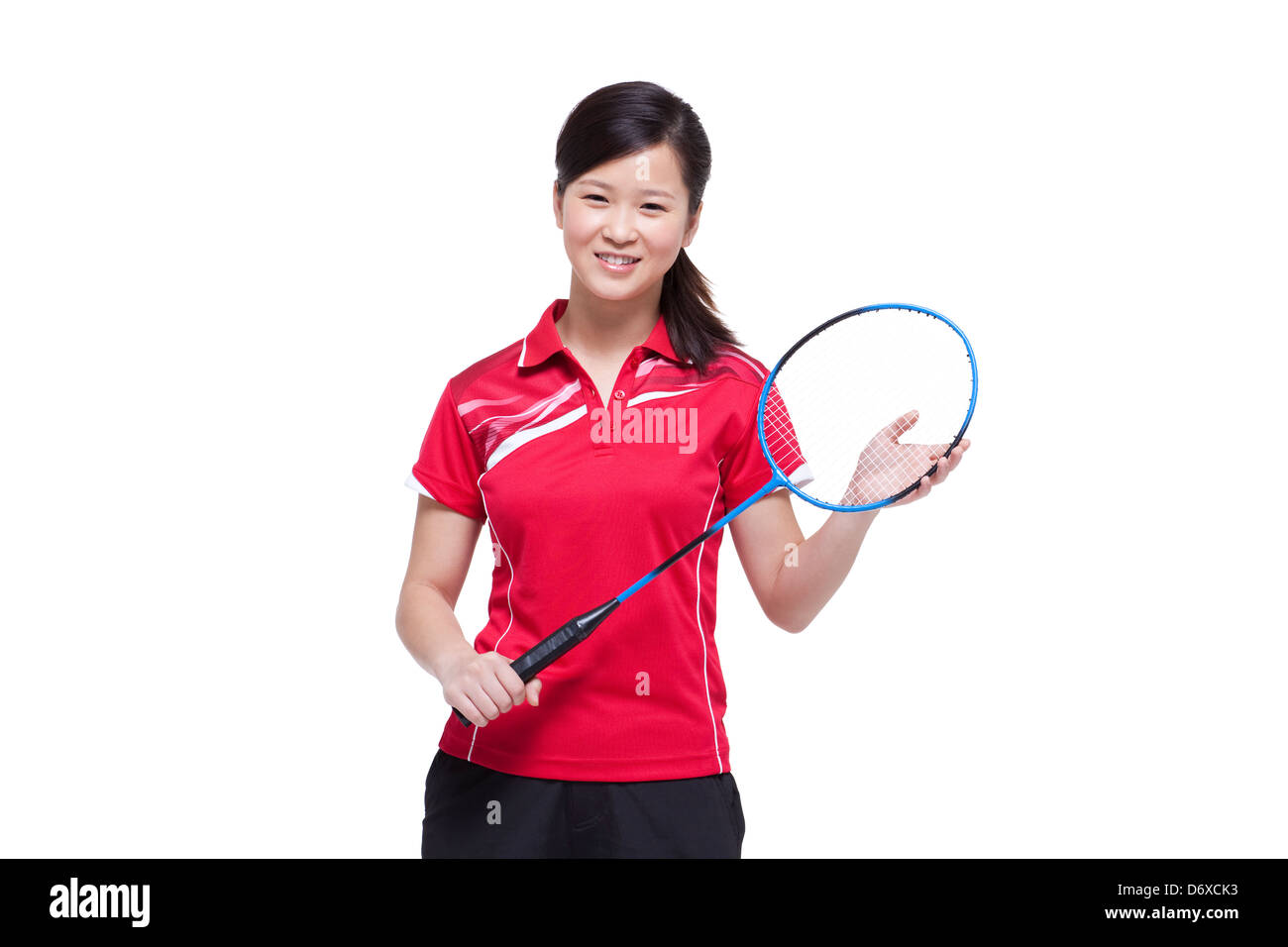 Female athlete playing badminton Stock Photo - Alamy