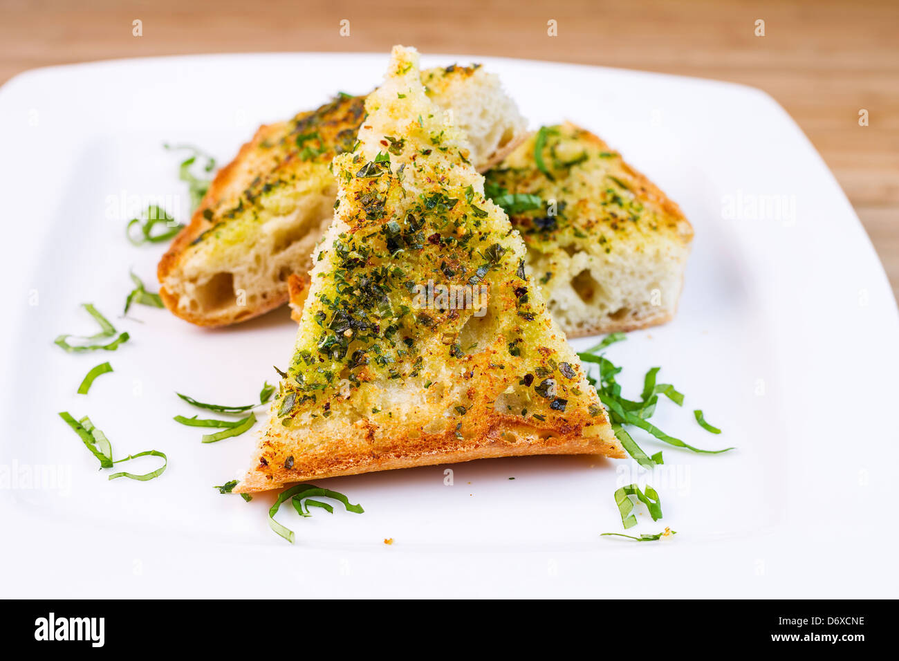Horizontal closeup photo of garlic bread seasoned fresh garlic, salt ...