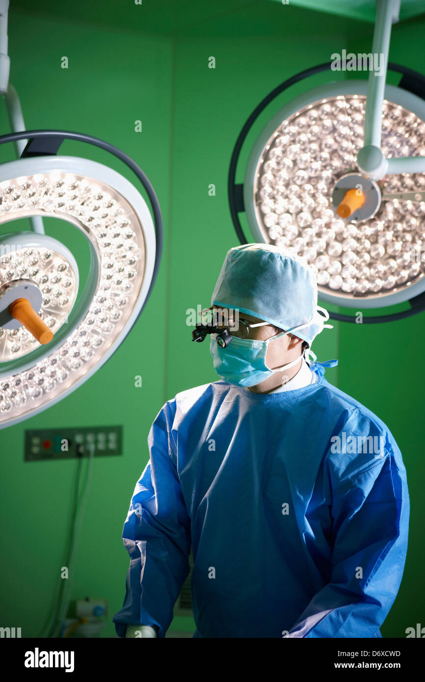 a surgeon wearing a medical loop glasses in operating room Stock Photo ...