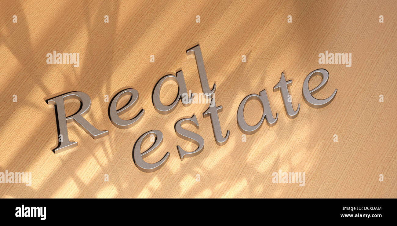real estate word written in metal letters over a wooden panel Stock ...